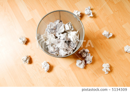 Stock Photo: Garbage bin with paper waste isolated on white - Stock ...