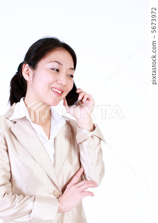 Business woman calling with a smile - Stock Photo [5673972] - PIXTA