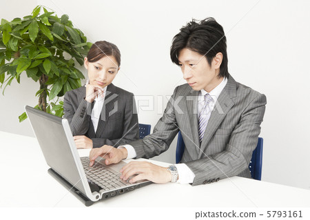 Two men and women and a personal computer... - Stock Photo [5793161 ...
