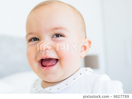 Closeup portrait of a smiling cute baby - Stock Photo [9827789] - PIXTA