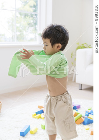 Boy changing clothes - Stock Photo [9993816] - PIXTA