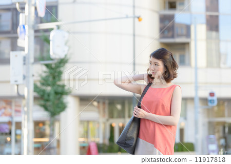 A young woman standing on the street corner - Stock Photo [11917818 ...