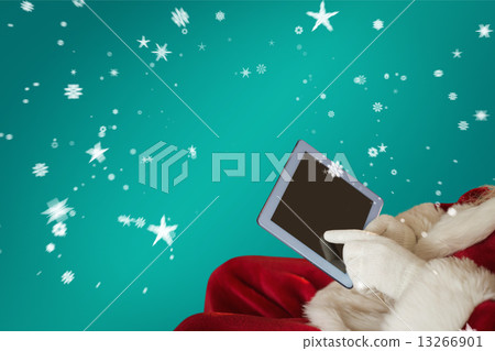 Composite image of santa using tablet on the... - Stock Illustration ...