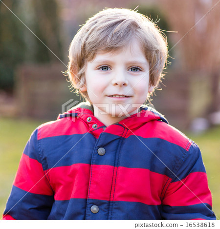 Portrait of happy little kid boy in red jacket,... - Stock Photo ...