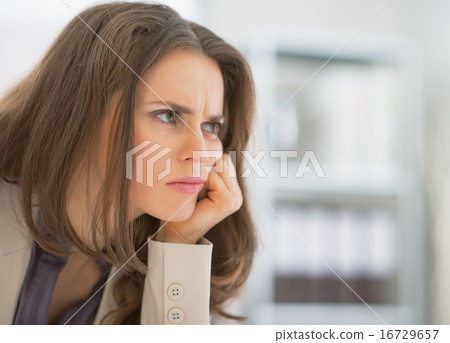 Portrait of frustrated business woman sitting... - Stock Photo ...