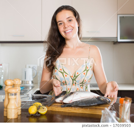 Woman cooking fish at kitchen - Stock Photo [17039503] - PIXTA