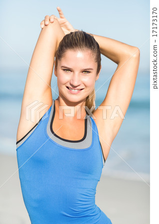 Beautiful fit woman stretching her arm - Stock Photo [17173170] - PIXTA