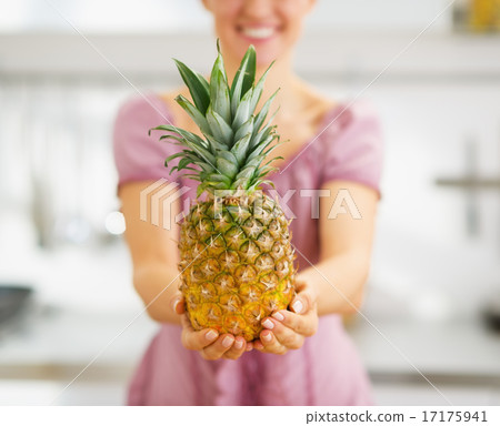 Closeup on pineapple in hand of housewife - Stock Photo [17175941] - PIXTA