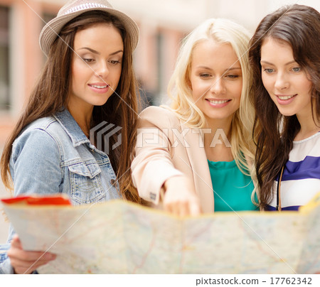 beautiful girls with map in the city - Stock Photo [17762342] - PIXTA