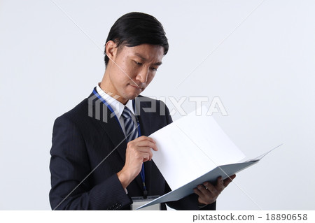 Businessman turning over the document - Stock Photo [18890658] - PIXTA