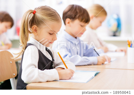 Pupils are writing in their copybooks - Stock Photo [18950041] - PIXTA