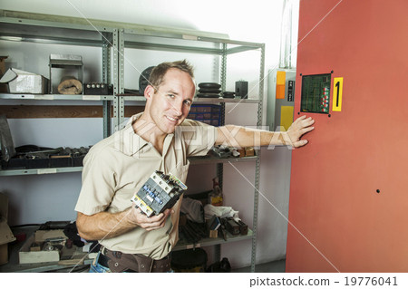 Elevator Repair Man at work - Stock Photo [19776041] - PIXTA