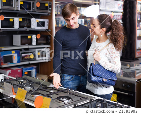 Stock Photo: family couple buying new gas-stove - Stock Image - Everypixel