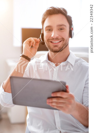 Stock Photo: Positive man using tablet - Stock Image - Everypixel