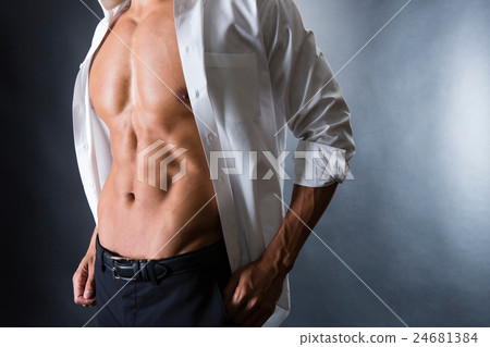 A man in a broken abdominal muscle - Stock Photo [24681384] - PIXTA
