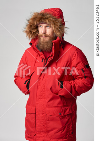 Man wearing red winter jacket with fur hood on - Stock Photo [25323461 ...