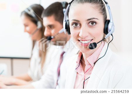 Stock Photo: Woman and men working as call center agents - Stock Image - Everypixel