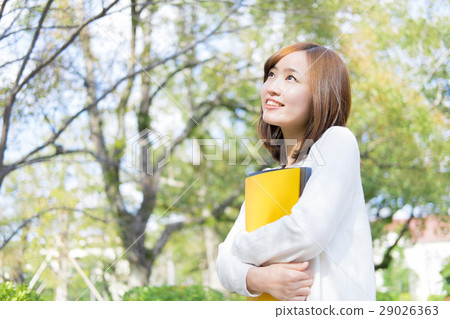 Smiley female college student - Stock Photo [29026363] - PIXTA