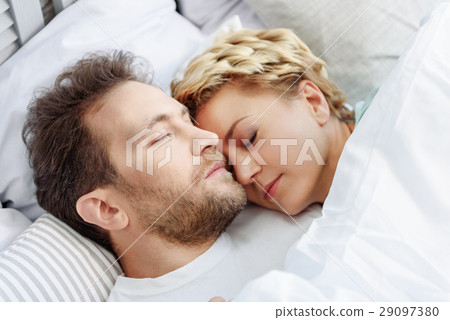 Happy husband and wife napping at home - Stock Photo [29097380] - PIXTA