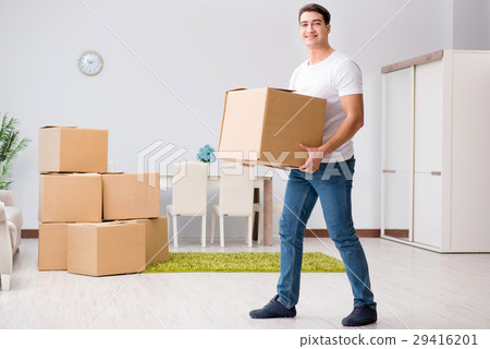 Young man moving boxes at home - Stock Photo [29416201] - PIXTA