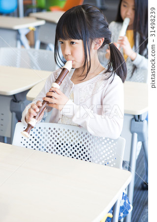 Elementary school student who blows recorder - Stock Photo [31498239 ...
