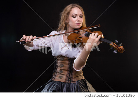 Blond young girl playing the fiddle - Stock Photo [33101380] - PIXTA