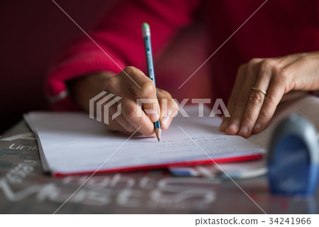 Hand writing on paper with pencil on desk - Stock Photo [34241966] - PIXTA