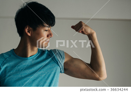 Young Japanese male muscle making a bicep - Stock Photo [36634244] - PIXTA