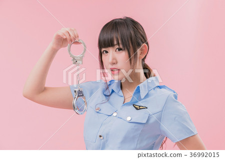 Female police cosplay handcuffs - Stock Photo [36992015] - PIXTA