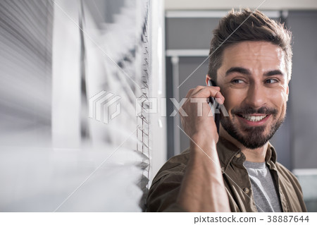 Happy guy enjoying pleasant conversation - Stock Photo [38887644] - PIXTA