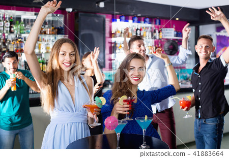 Women are drinking cocktails and having fun in... - Stock Photo ...
