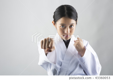 A female karateka who holds a fist with a... - Stock Photo [43360053 ...
