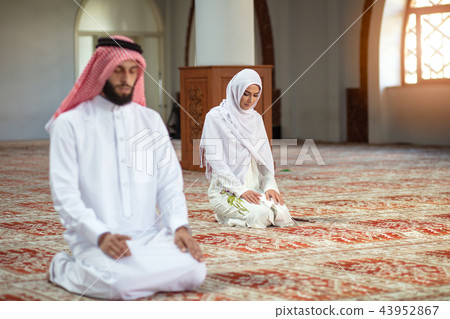 Muslim Husband And Wife Praying