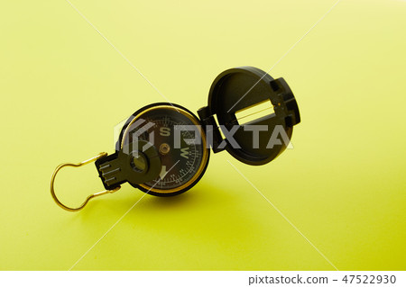 Minimal Compass on bright yellow background - Stock Photo [47522930 ...