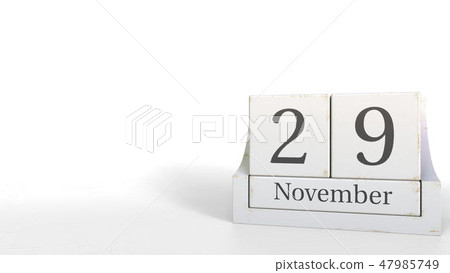 Wood cube calendar shows November 29 date, 3D... - Stock Illustration ...