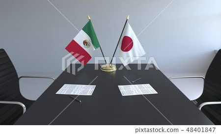 Flags of Mexico and Japan and papers on the... - Stock Illustration ...