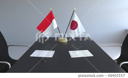 Flags of Indonesia and Japan and papers on the... - Stock Illustration ...
