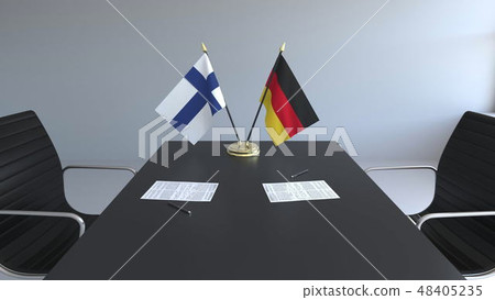 Flags of Finland and Germany and papers on the... - Stock Illustration ...