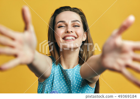 Beautiful happy woman with open hand ready for - Stock Photo [49369184 ...