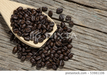 The coffee seeds in the glass put on the table - Stock Photo [53981106 ...