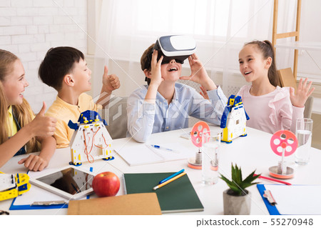 Children having fun with vr goggles in classroom - Stock Photo ...