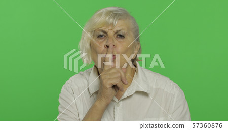 An elderly woman showing shh gesture. Old... - Stock Photo [57360876 ...