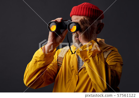 old explorer looking with binocular at the distance - Stock Image ...