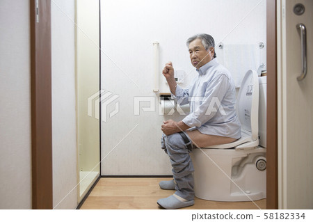 Man Using Toilet