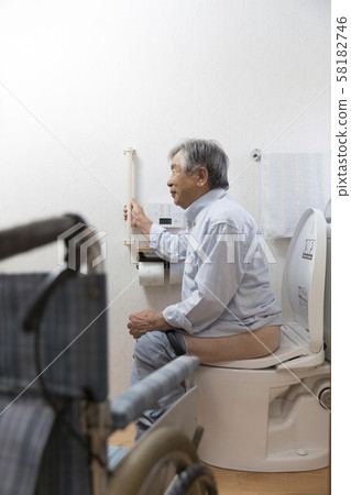 Man Using Toilet