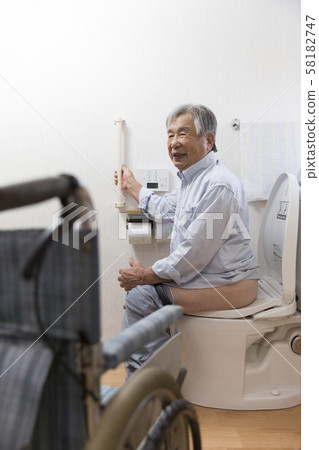 Man Using Toilet
