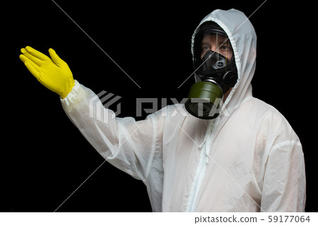 A man in a gas mask and chemical protection suit - Stock Photo ...