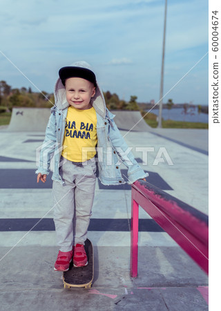 Little boy rides a skateboard in summer in the... - Stock Photo ...