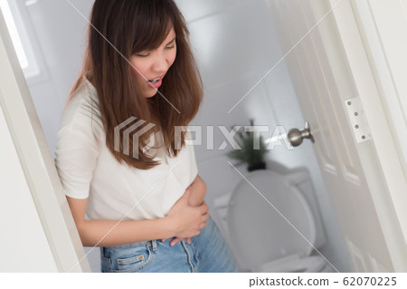 woman with diarrhea symptom; sick woman suffering - Stock Photo ...