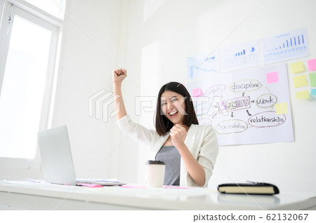 Successful business woman working in a workplace - Stock Photo ...